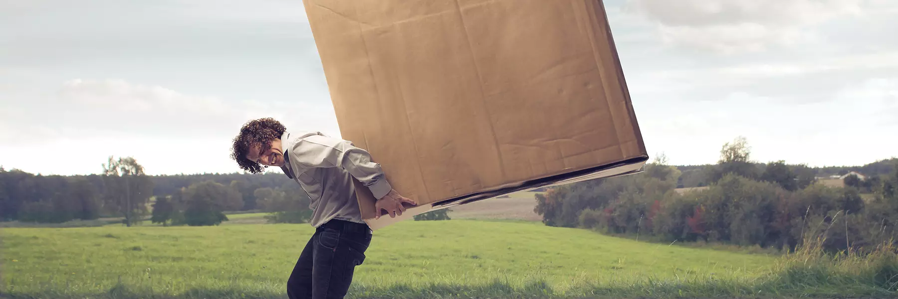Carrying A Heavy Burden African Woman Carrying A Heavy Burden Over Her